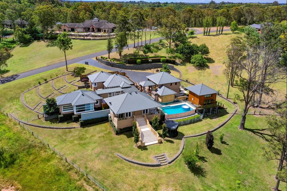 Hillside Luxury: Above-Ground Infinity Pool in Picton | Tropical Pools ...
