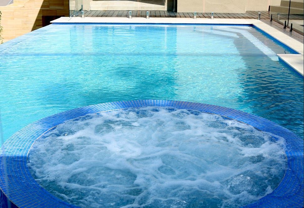 Hillside Luxury: Above-Ground Infinity Pool in Picton | Tropical Pools ...