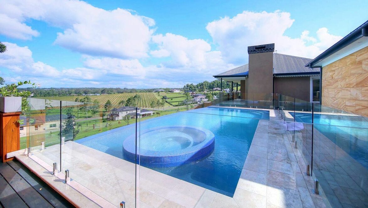 Hillside Luxury: Above-Ground Infinity Pool in Picton | Tropical Pools ...