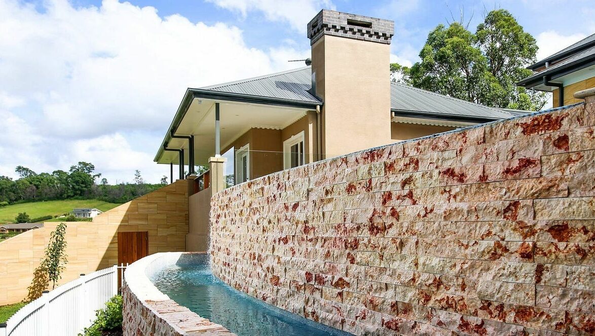 Hillside Luxury: Above-Ground Infinity Pool in Picton | Tropical Pools ...